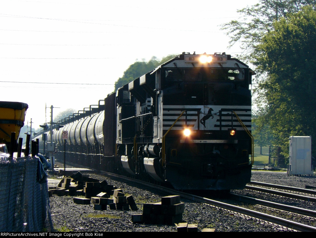 Westbound empty oil cans at 7:54 a.m.